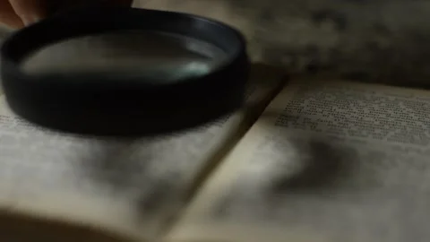 detective using a magnifying glass for ... | Stock Video | Pond5