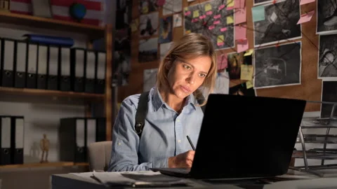 Detective working at desk in her office,... | Stock Video | Pond5
