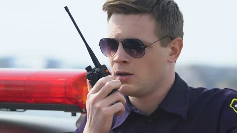 Determined policeman accepting call and ... | Stock Video | Pond5