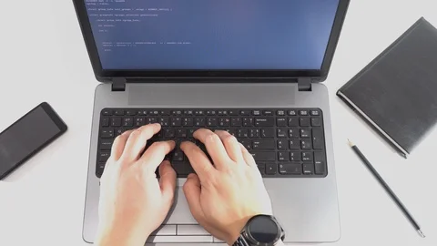 Developer coding on a laptop - top view | Stock Video | Pond5