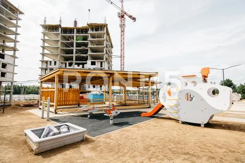 Developmental playground with construction cranes and site in the ...