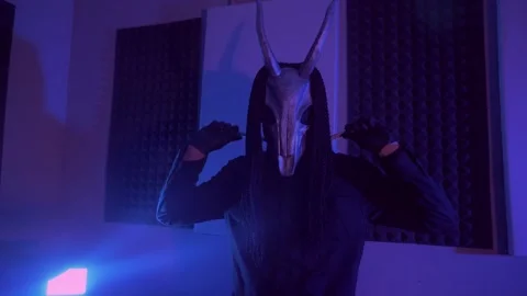 The devil monster plays the drums. A man... | Stock Video | Pond5