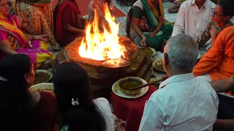 Devotees performing Hawan, aarti and puj... | Stock Video | Pond5