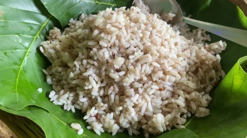 Dheki brown rice served in Sal leaves in... | Stock Video | Pond5