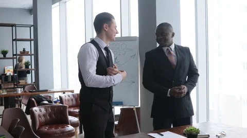 Dialogue of two men at work, young busin... | Stock Video | Pond5