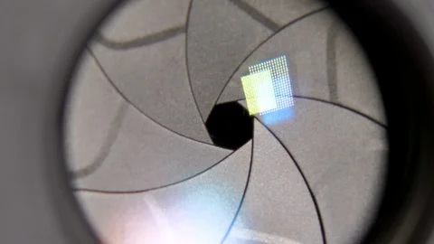 Diaphragm blades of the fixed lens openi... | Stock Video | Pond5