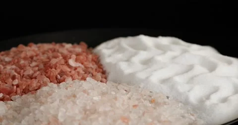 Different salt types rotating on black b... | Stock Video | Pond5
