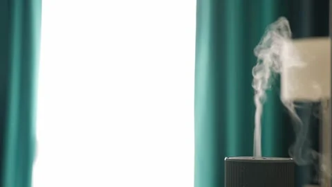 Diffuser diffusing steam in apartment ro... | Stock Video | Pond5