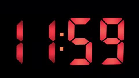 Digital clock displays the time 1159 in ... | Stock Video | Pond5