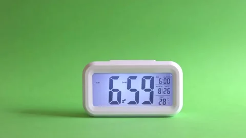 Digital clock, time changes from 6:59 to... | Stock Video | Pond5