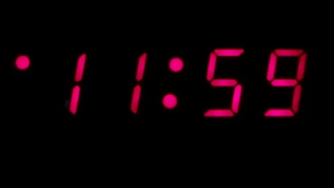 Digital Clock Turning Midnight | Stock Video | Pond5