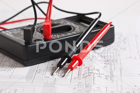 Digital multimeter and an electronic circuit Stock Image #11935351