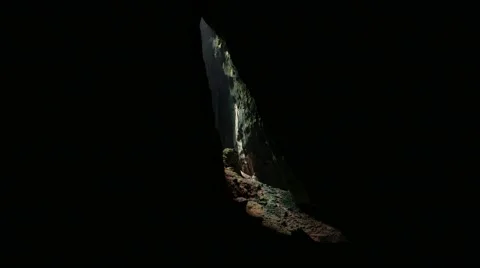 Dim light in dark cave, rocky floor and ... | Stock Video | Pond5
