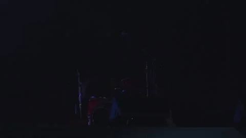 Dimly Lit Stage with Drum Set and Microp... | Stock Video | Pond5