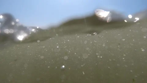 Dipping Intermittently Beneath Waves wit... | Stock Video | Pond5