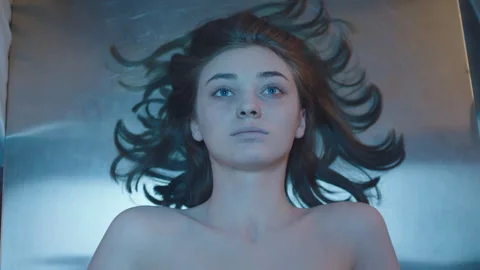 Directly above a female corpse on the ta... | Stock Video | Pond5