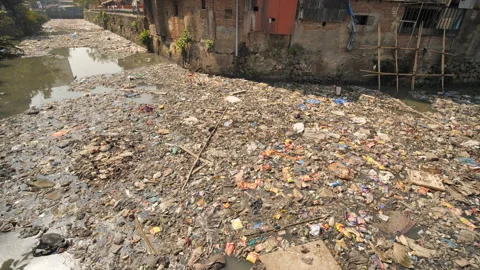 Dirty river in Dharavi slums. Mumbai. In... | Stock Video | Pond5