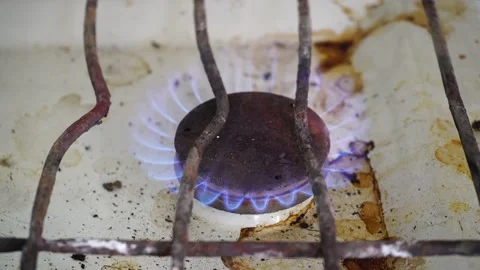 Dirty rusty gas burner of an old gas sto... | Stock Video | Pond5