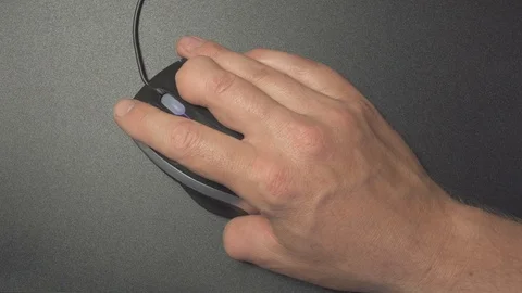 Disabled hand with a computer mouse on a... | Stock Video | Pond5