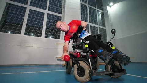 A disabled man in wheelchair. Throwing r... | Stock Video | Pond5