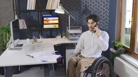 Disabled office worker in a wheelchair. | Stock Video | Pond5