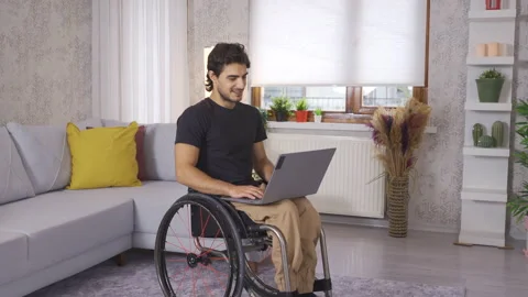 Disabled young man making a video call i... | Stock Video | Pond5