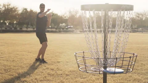 Disc Golfer Throws a Thumber into Disc G... | Stock Video | Pond5