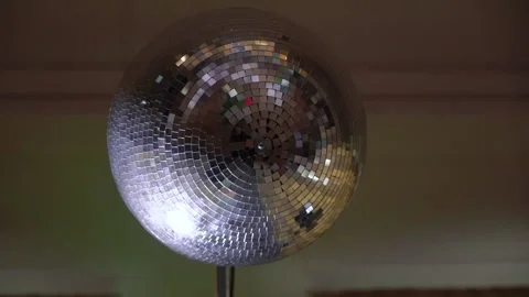 A disco ball suspended from the ceiling ... | Stock Video | Pond5