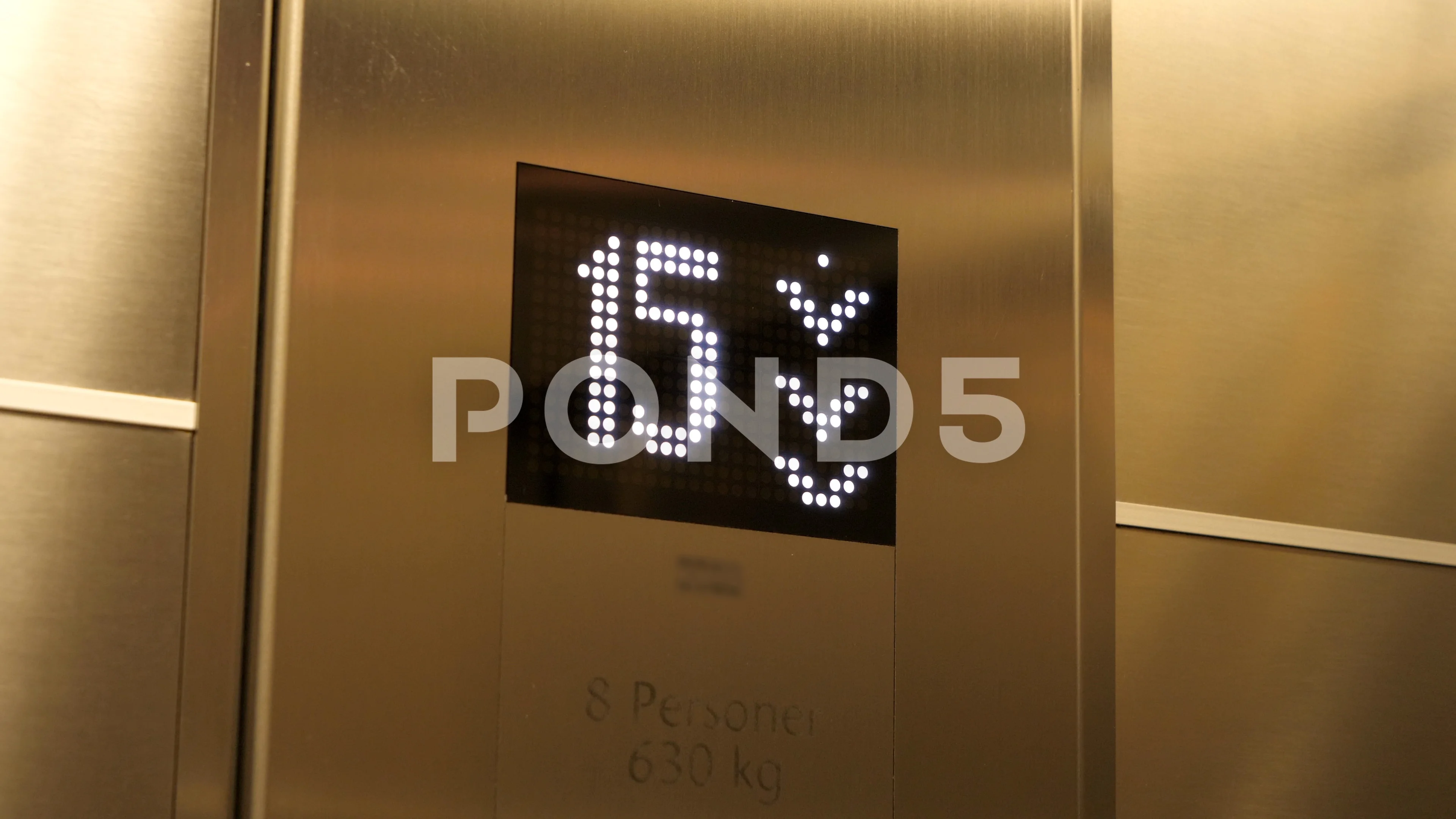 Elevator Going Down Man Stands In Modern Elevator With Iron Doors.