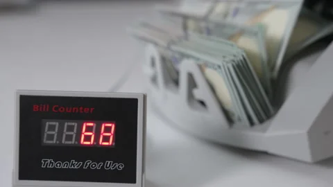 Display with figures of cash counter mac... | Stock Video | Pond5