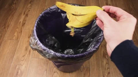 Dispose of food waste, throw banana peel... | Stock Video | Pond5