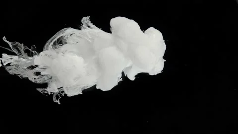 Dissolution of white paint on a black ba... | Stock Video | Pond5