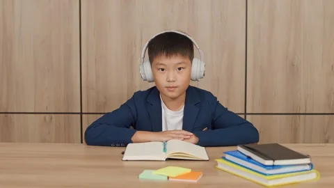 Distance learning, asian teen boy in a w... | Stock Video | Pond5
