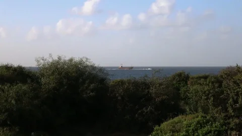 Distance view of a ship sailing on ocean... | Stock Video | Pond5