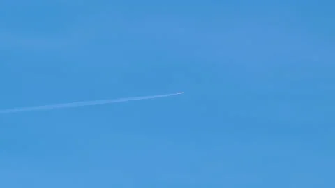 Distant passenger jet plane flying on hi... | Stock Video | Pond5