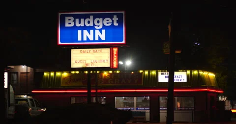 Dive motel Budget Inn sign flickering at... | Stock Video | Pond5