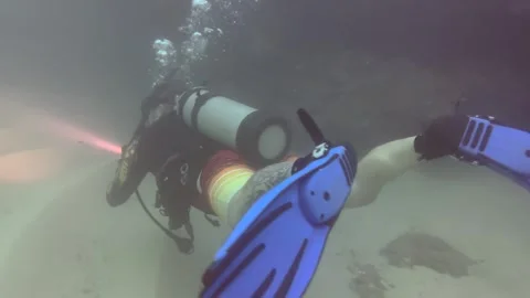 diver explores underwater cave, lava tub... | Stock Video | Pond5