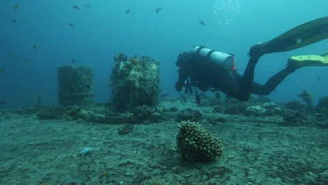 Diver exploring sunken ship underwater, ... | Stock Video | Pond5