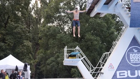 Diver jumps from the diving board at "De... | Stock Video | Pond5