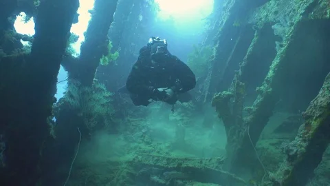 Diver Photographer Inside Ship Wreck Und... | Stock Video | Pond5