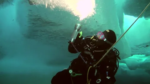 Diver under the ice of the North Pole. | Stock Video | Pond5