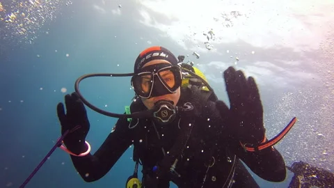 Diver waving Hello underwater in Atlanti... | Stock Video | Pond5