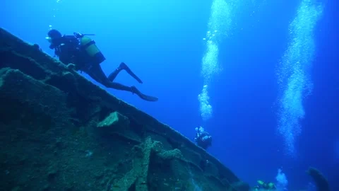 Divers Floating Under The Sea Around The... | Stock Video | Pond5