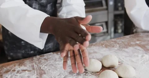 Diverse bakers working in bakery kitchen... | Stock Video | Pond5