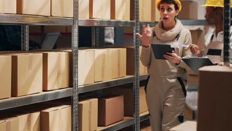 Diverse employees counting boxes of prod... | Stock Video | Pond5