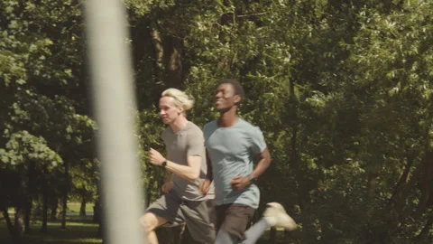 Diverse Male Friends Running Together in... | Stock Video | Pond5