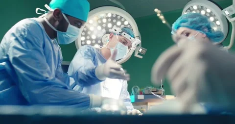 Diverse team of professional surgeons pe... | Stock Video | Pond5