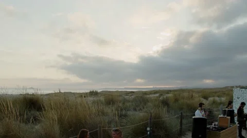 DJ playing at a beach sunset party at Co... | Stock Video | Pond5