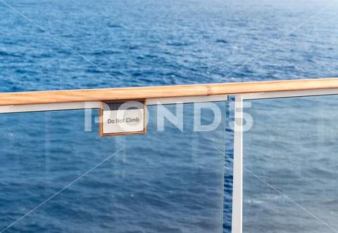 Do Not Climb warning sign on railing of cruise ship Stock Image #87762826