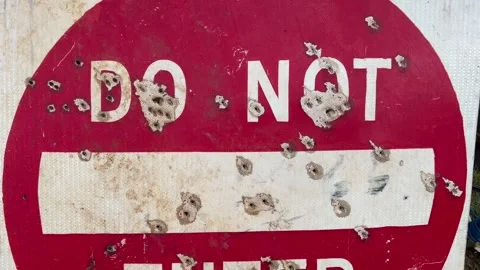 Do Not Enter Sign with bullet holes | Stock Video | Pond5